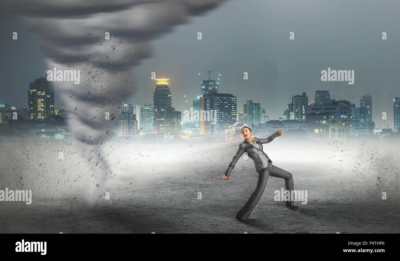 Woman running from papers Stock Photo - Alamy
