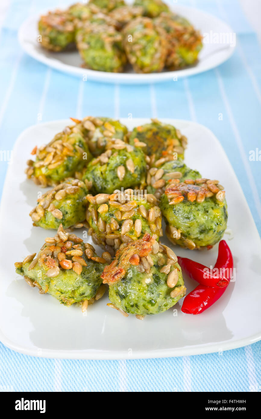 Spinach dumplings with sunflowers Stock Photo - Alamy