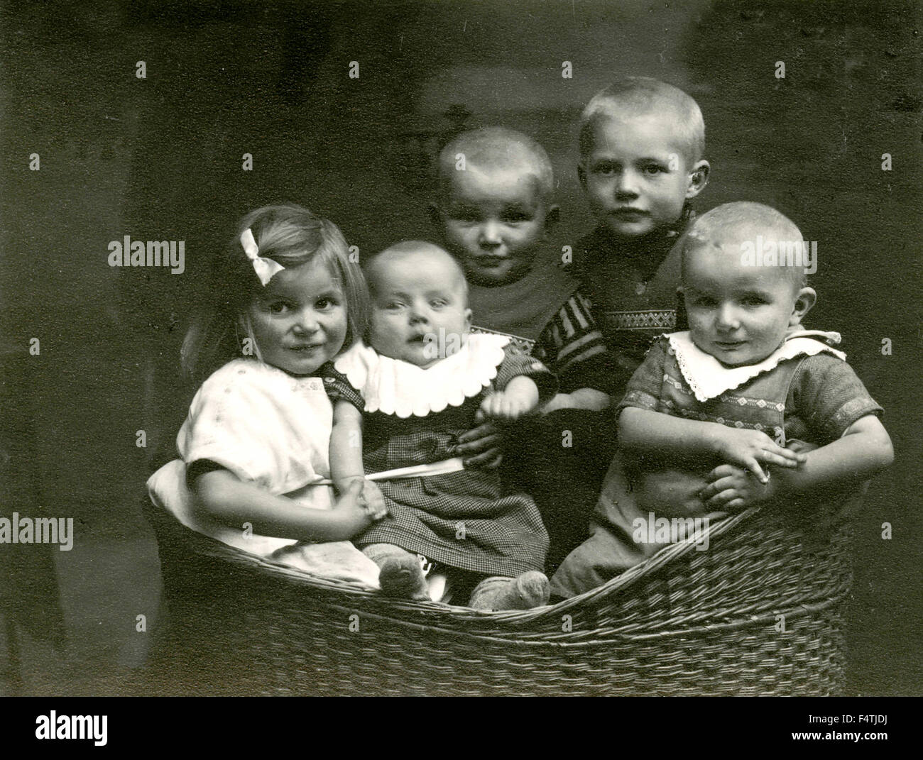Five children in a basket Stock Photo - Alamy