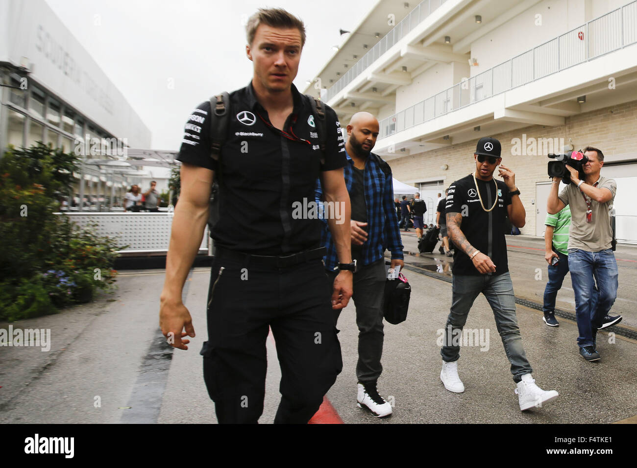 Lewis hamilton arrives in the paddock hi-res stock photography and ...