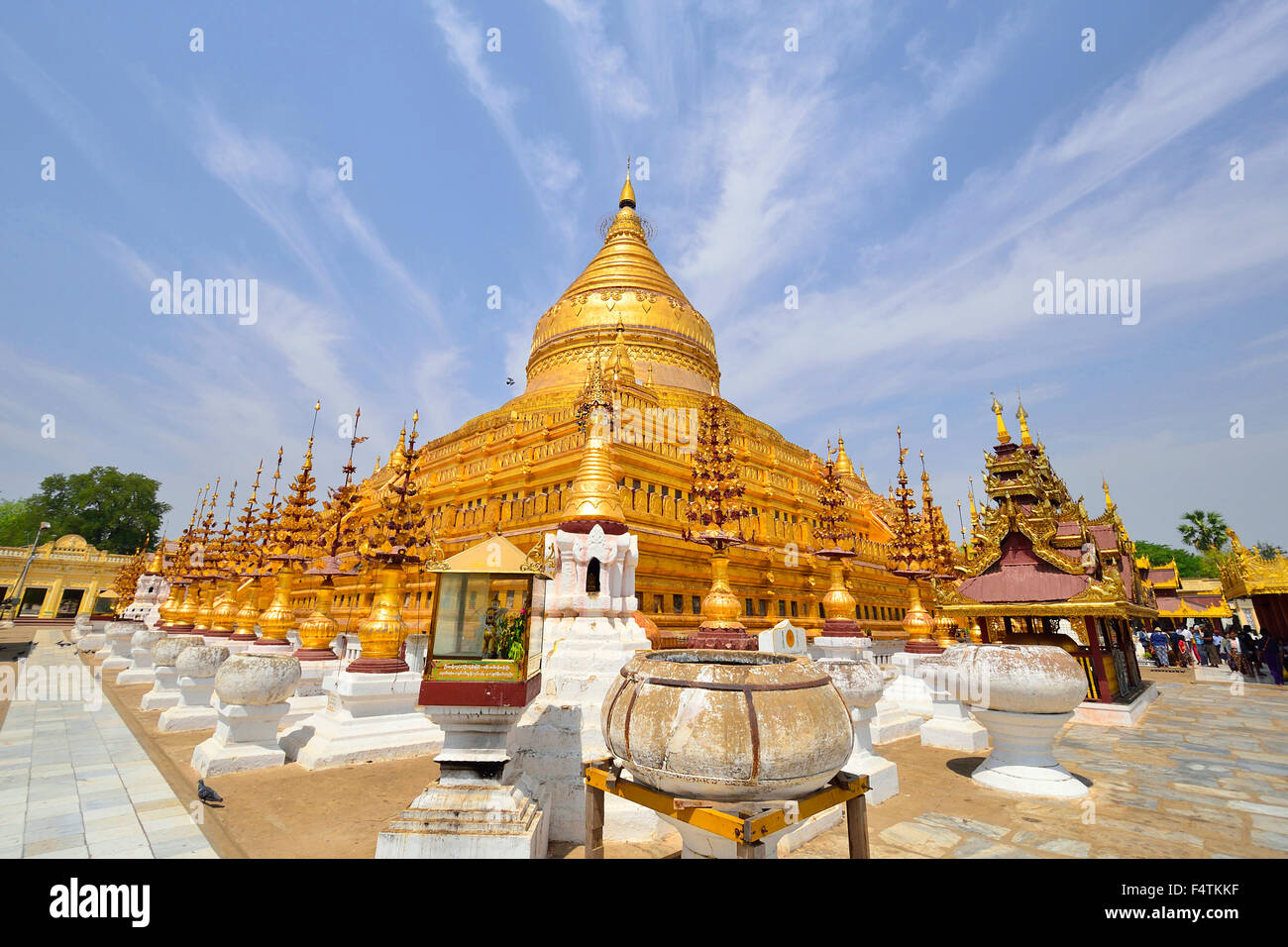 Shwezigon pagoda with its circular gold leaf-gilded stupa surrounded by ...