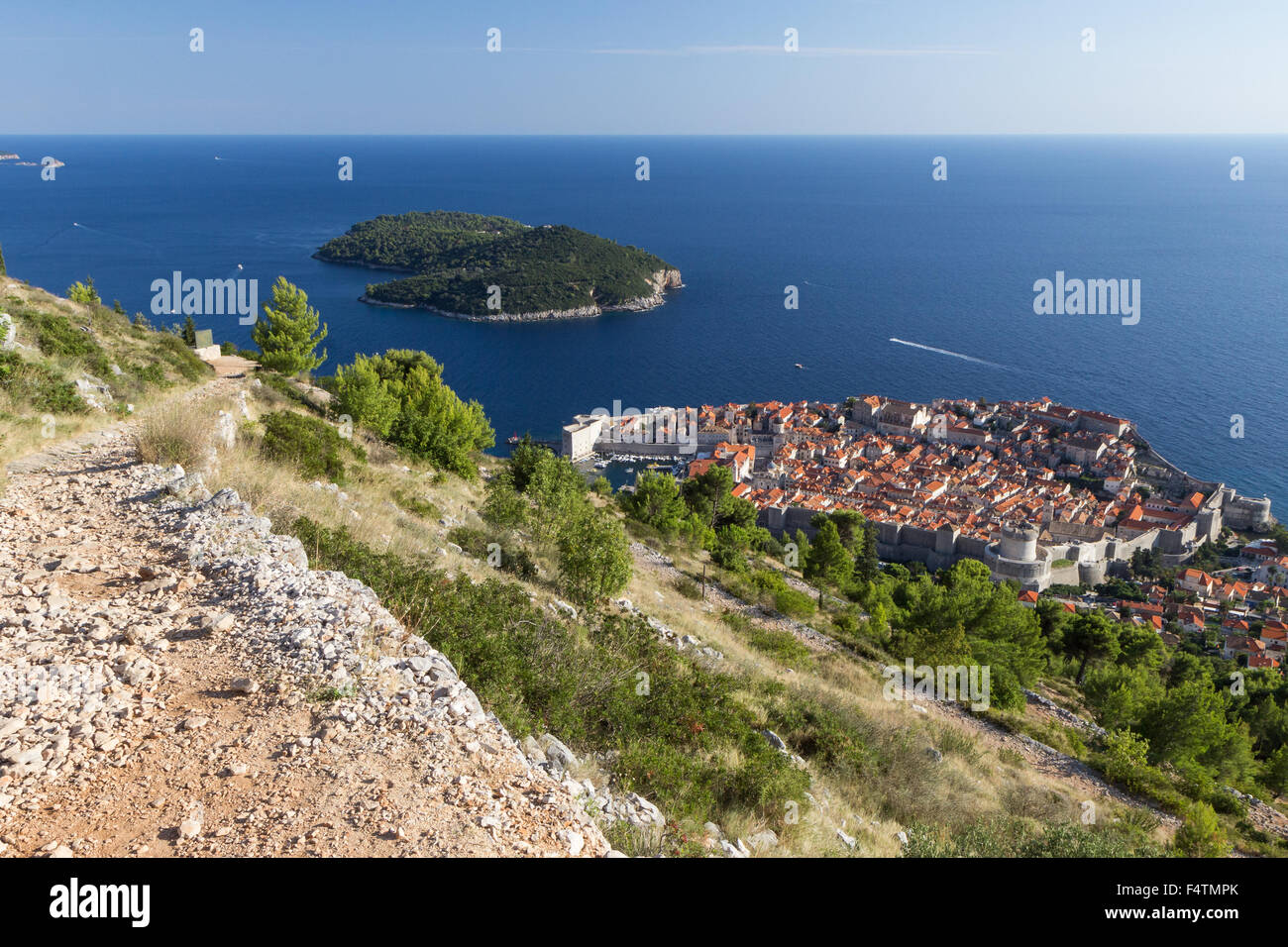View of a rocky path at the Mount Srd, the walled Old Town and Lokrum ...