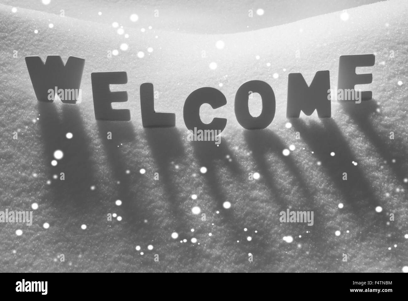 White Word Welcome On Snow, Snowflakes Stock Photo - Alamy