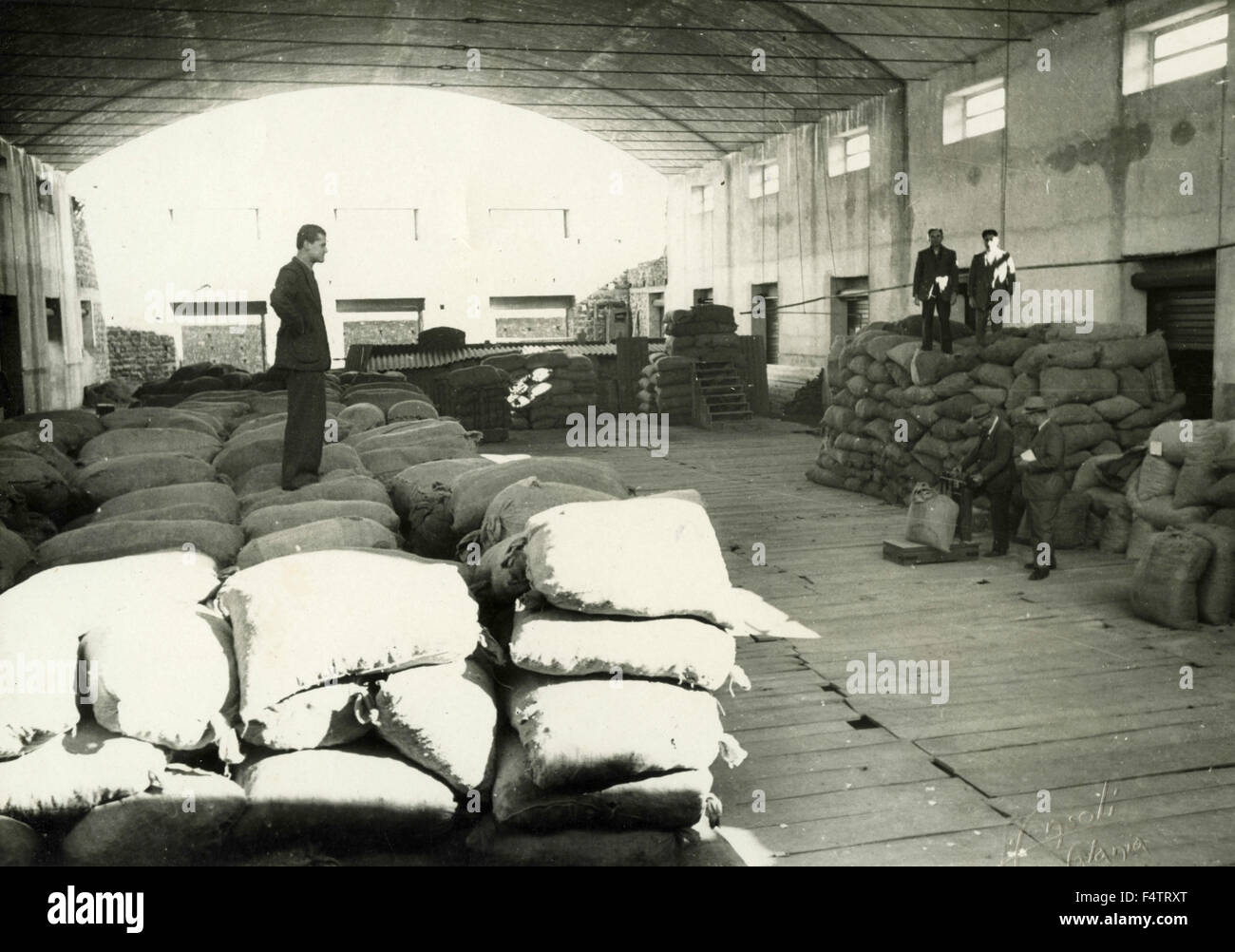 Storage of carob pulp in a plant in Catania, Italy Stock Photo - Alamy