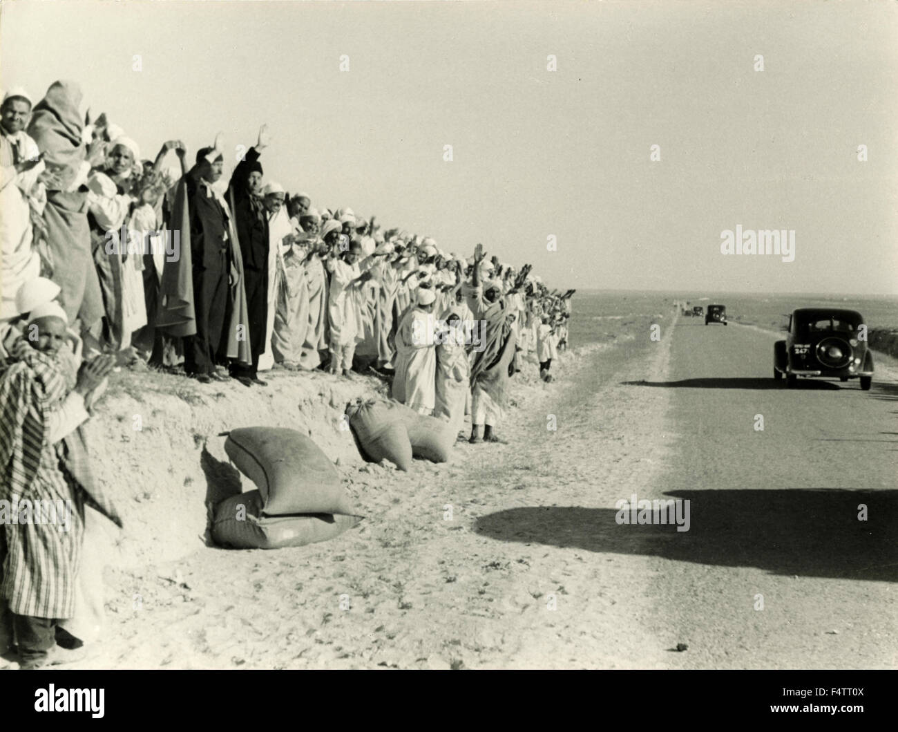 Libyan people celebrates the passage of the fascist hierarchy cars ...