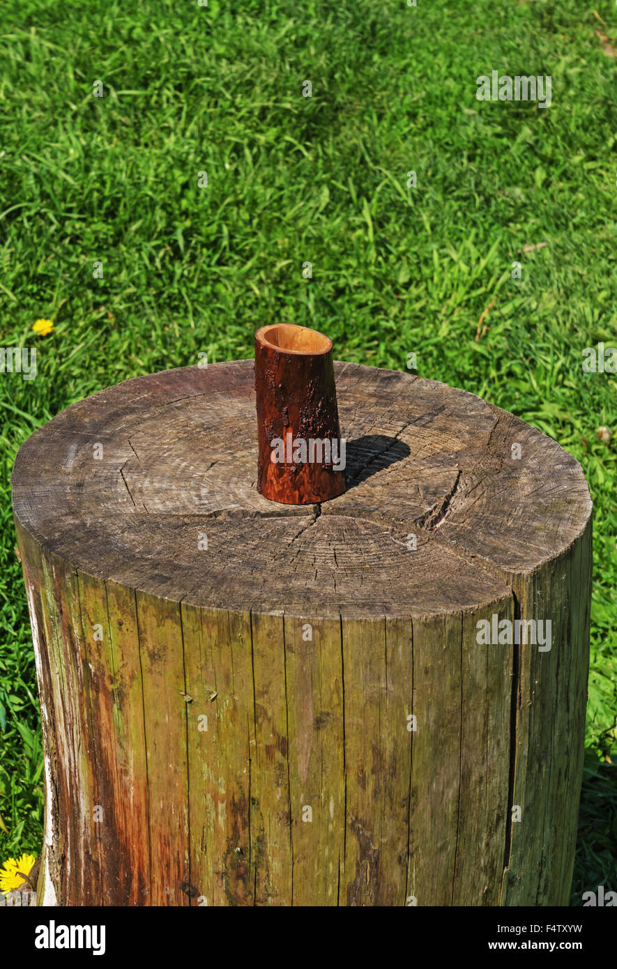Carved handmade wood vase on wooden gray stub Stock Photo - Alamy