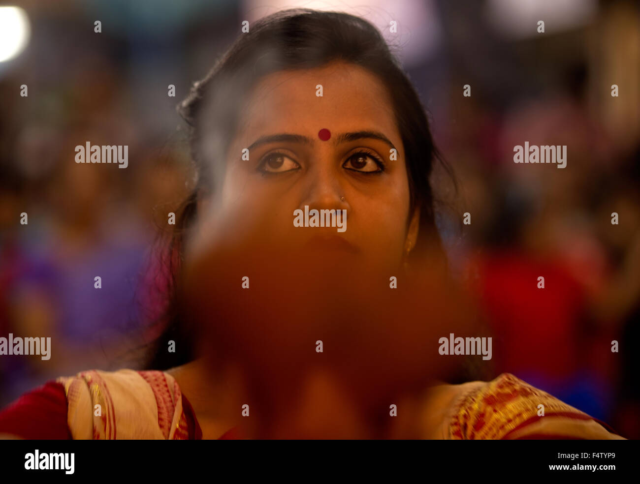 Traditional Bengali woman performing the Dhunuchi Dance during the ...