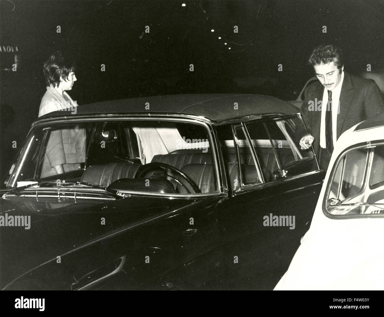 Actors Liza Minnelli and Domenico Modugno climb into a car, Italy Stock ...