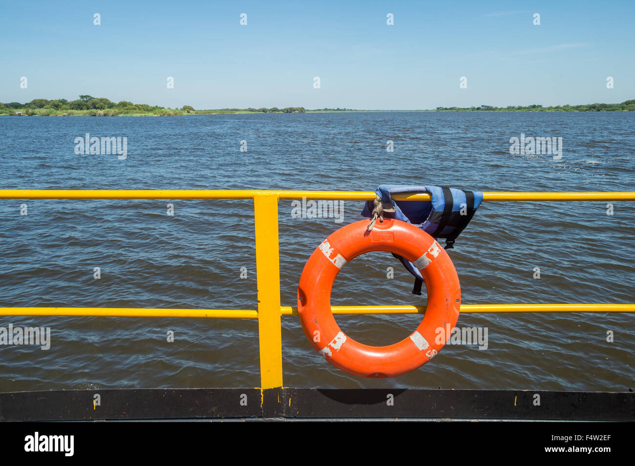 Kasane, Botswana - Life raft on railing of barge looking across river ...