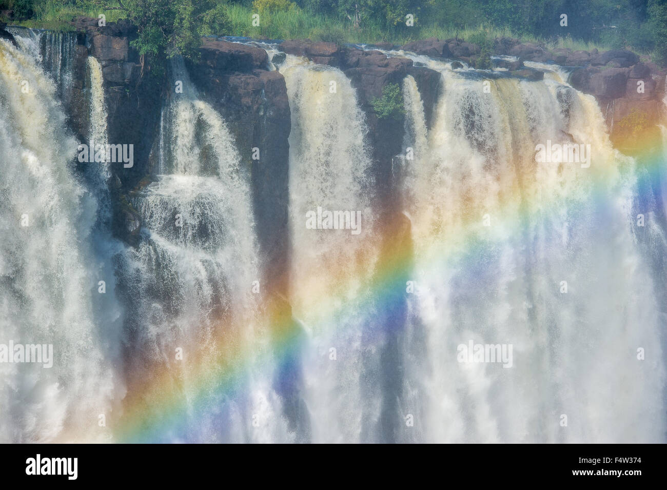LIVINGSTONE, ZAMBIA - Victoria Falls Waterfall with rainbow Stock Photo ...