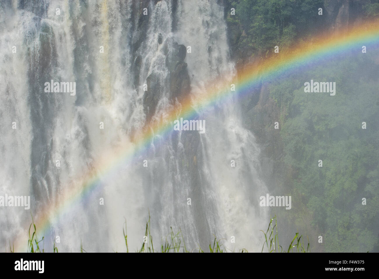 LIVINGSTONE, ZAMBIA - Victoria Falls Waterfall with rainbow Stock Photo ...