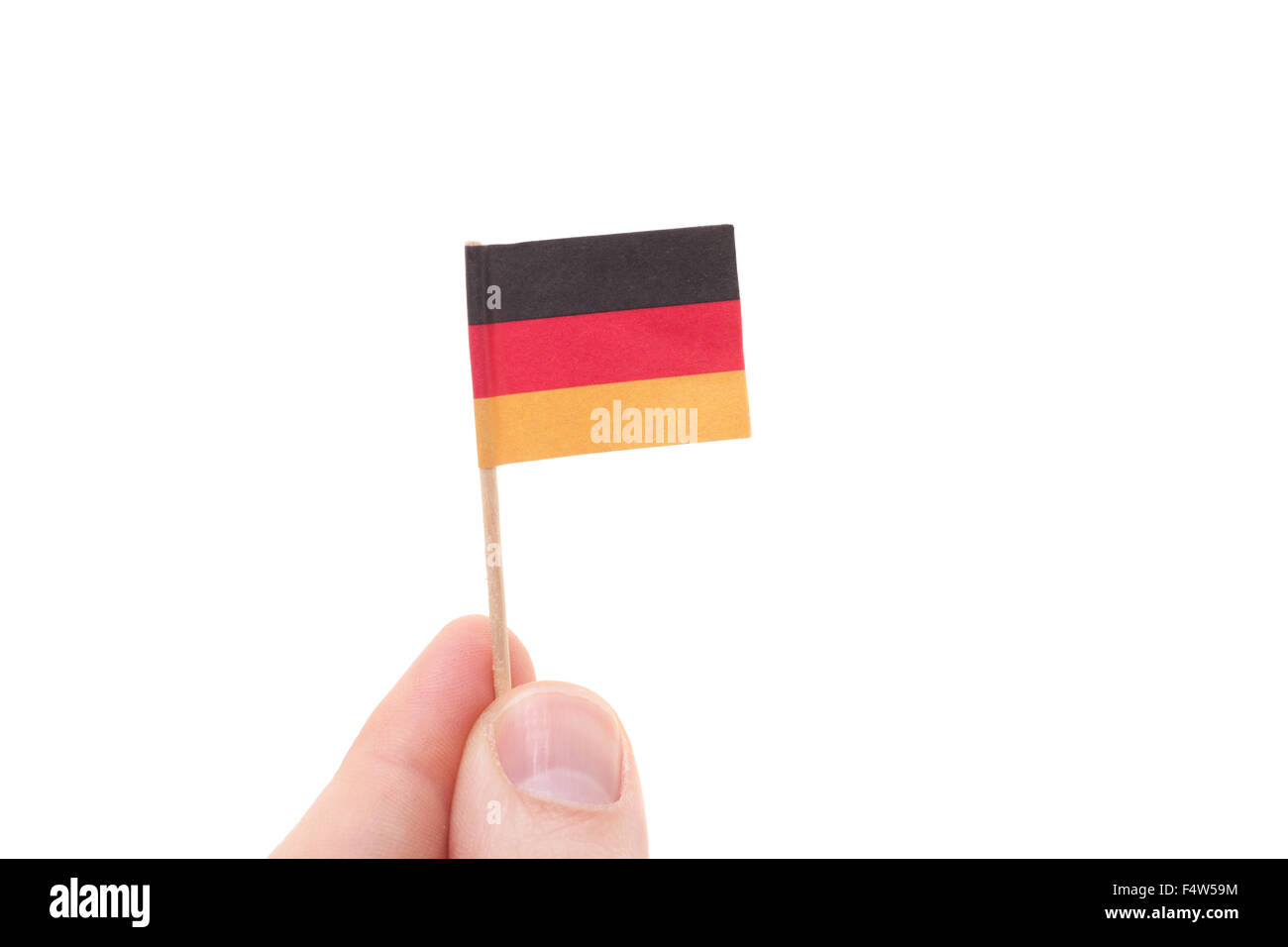 Hand holding german flag. All on white background Stock Photo - Alamy