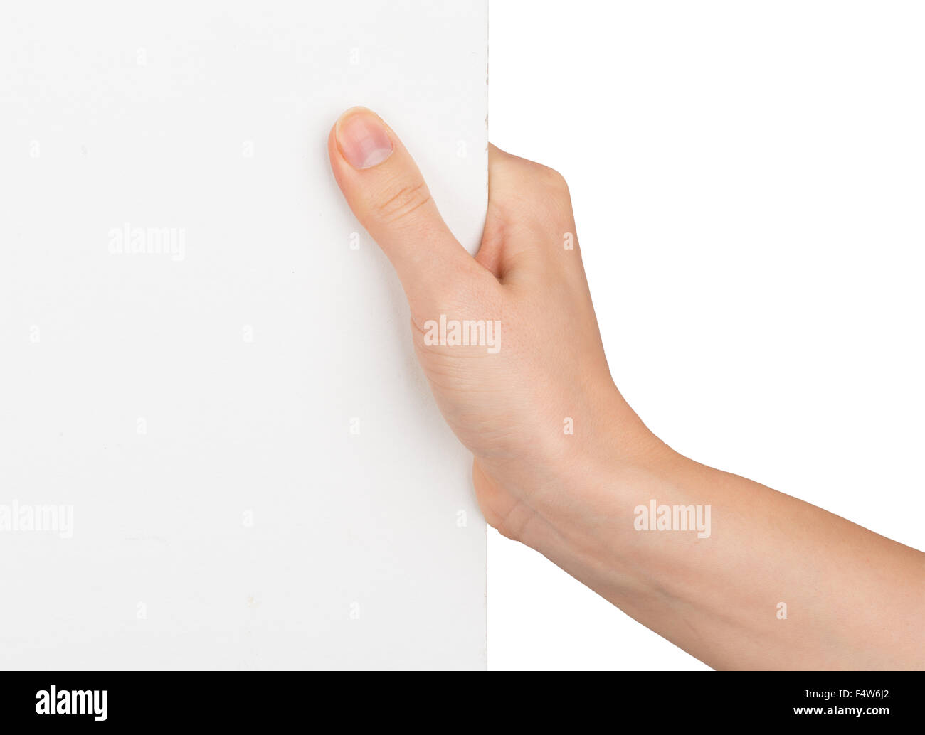 Womans hand holding edge of blank paper Stock Photo - Alamy