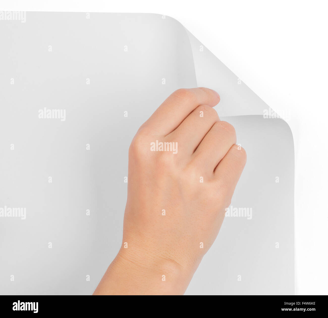 Womans hand turning blank page Stock Photo - Alamy