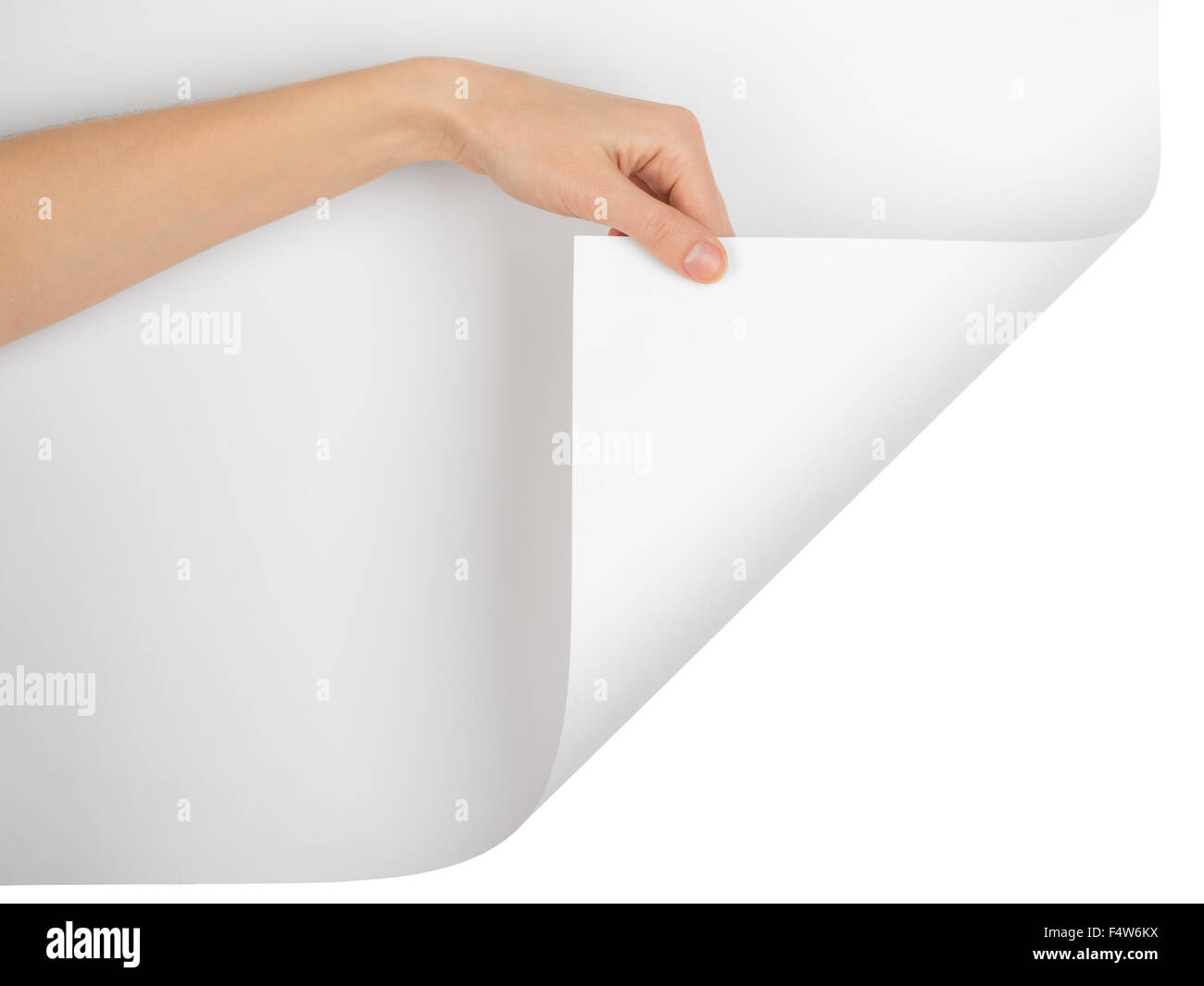 Womans hand turning empty page corner Stock Photo - Alamy