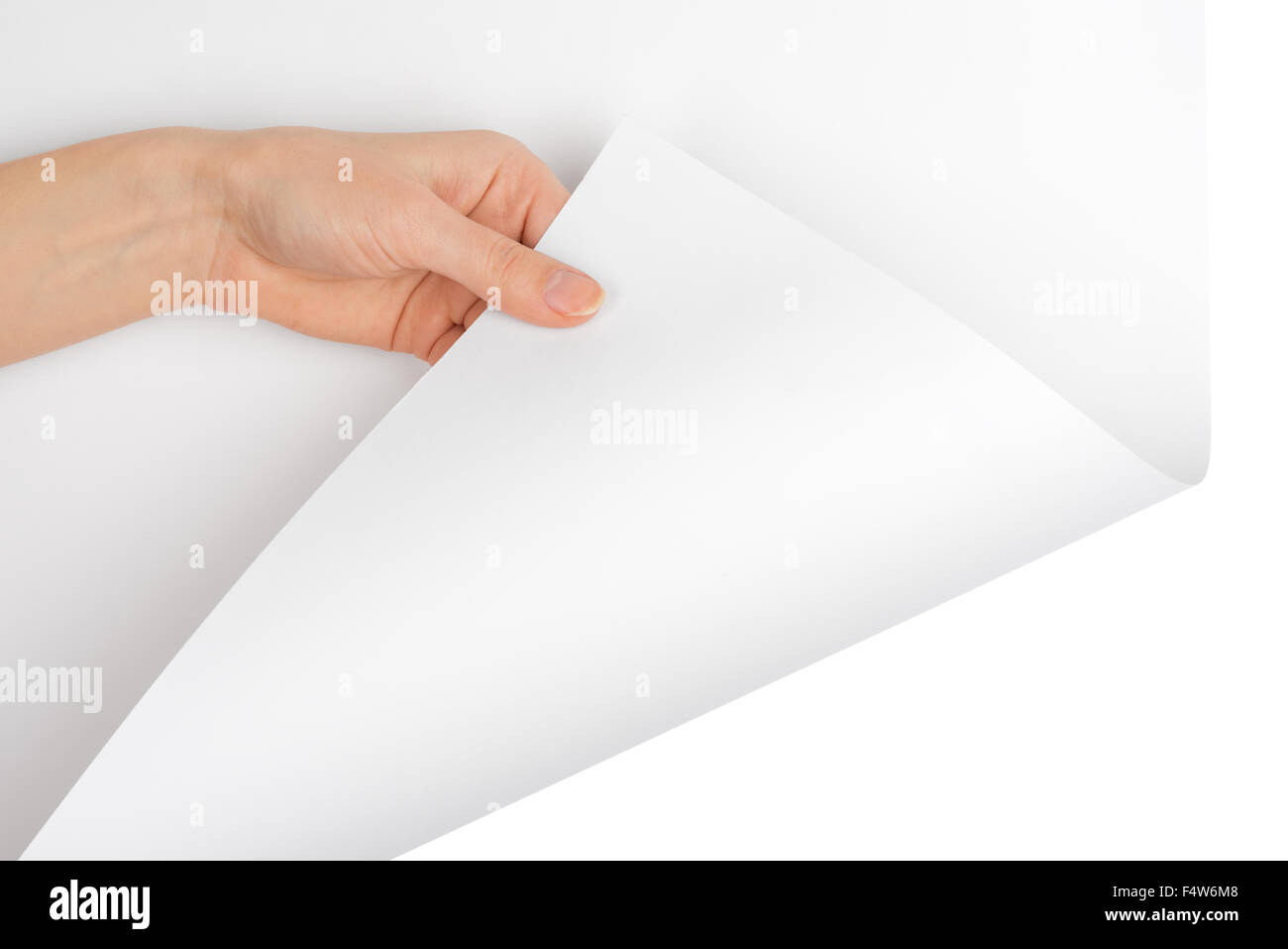 Humans hand turning bottom empty page corner Stock Photo - Alamy