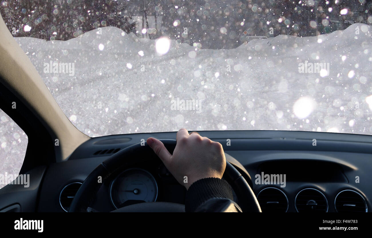 Bad snow weather on the road Stock Photo - Alamy