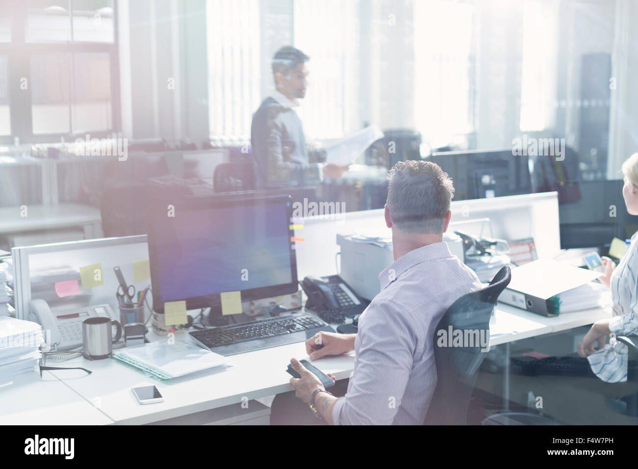 Working at desk hi-res stock photography and images - Alamy