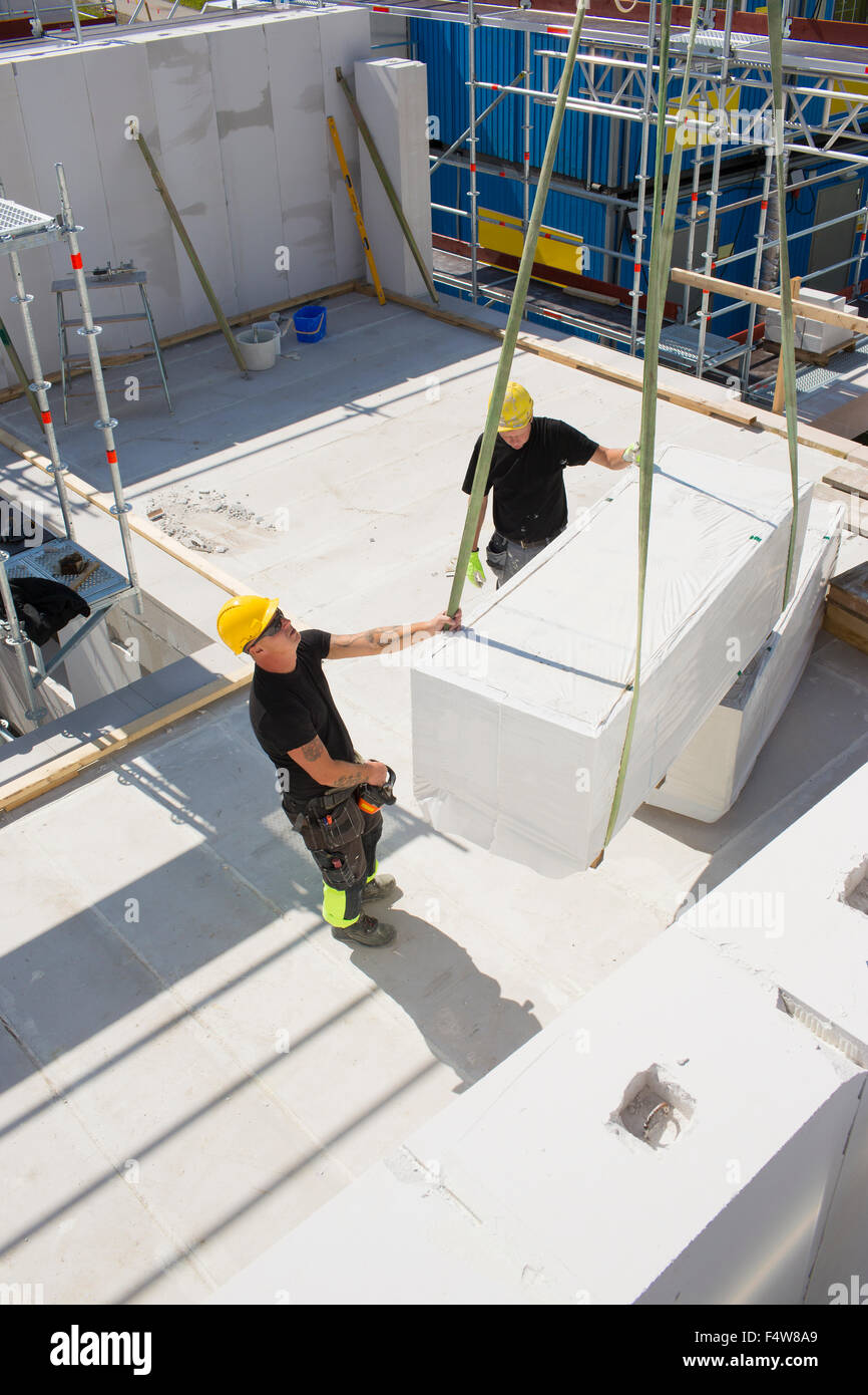 Construction worker putting hi-res stock photography and images - Alamy