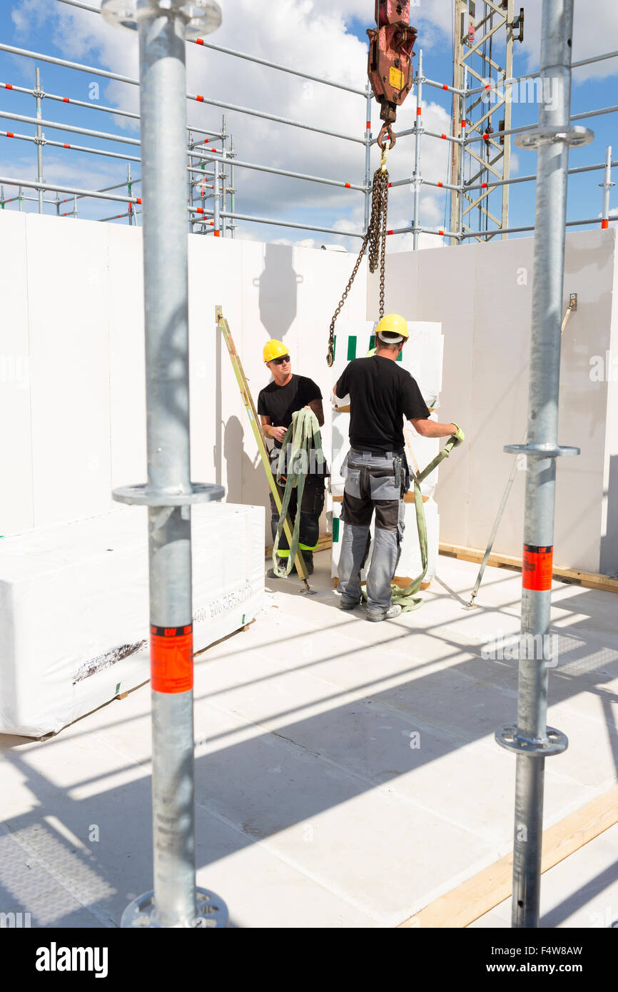 Construction worker putting hi-res stock photography and images - Alamy
