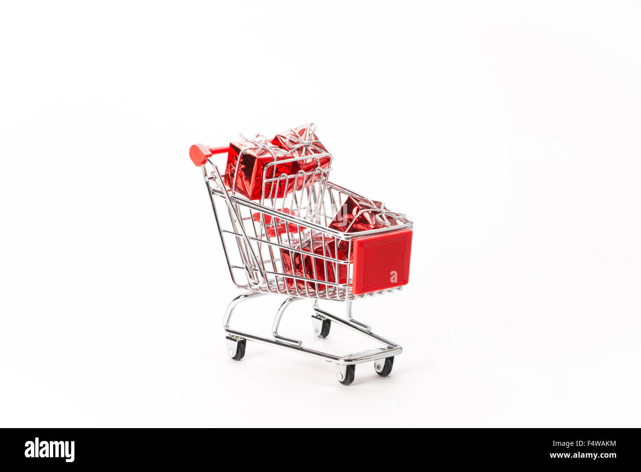 Caddy for shopping with gift on white background Stock Photo - Alamy