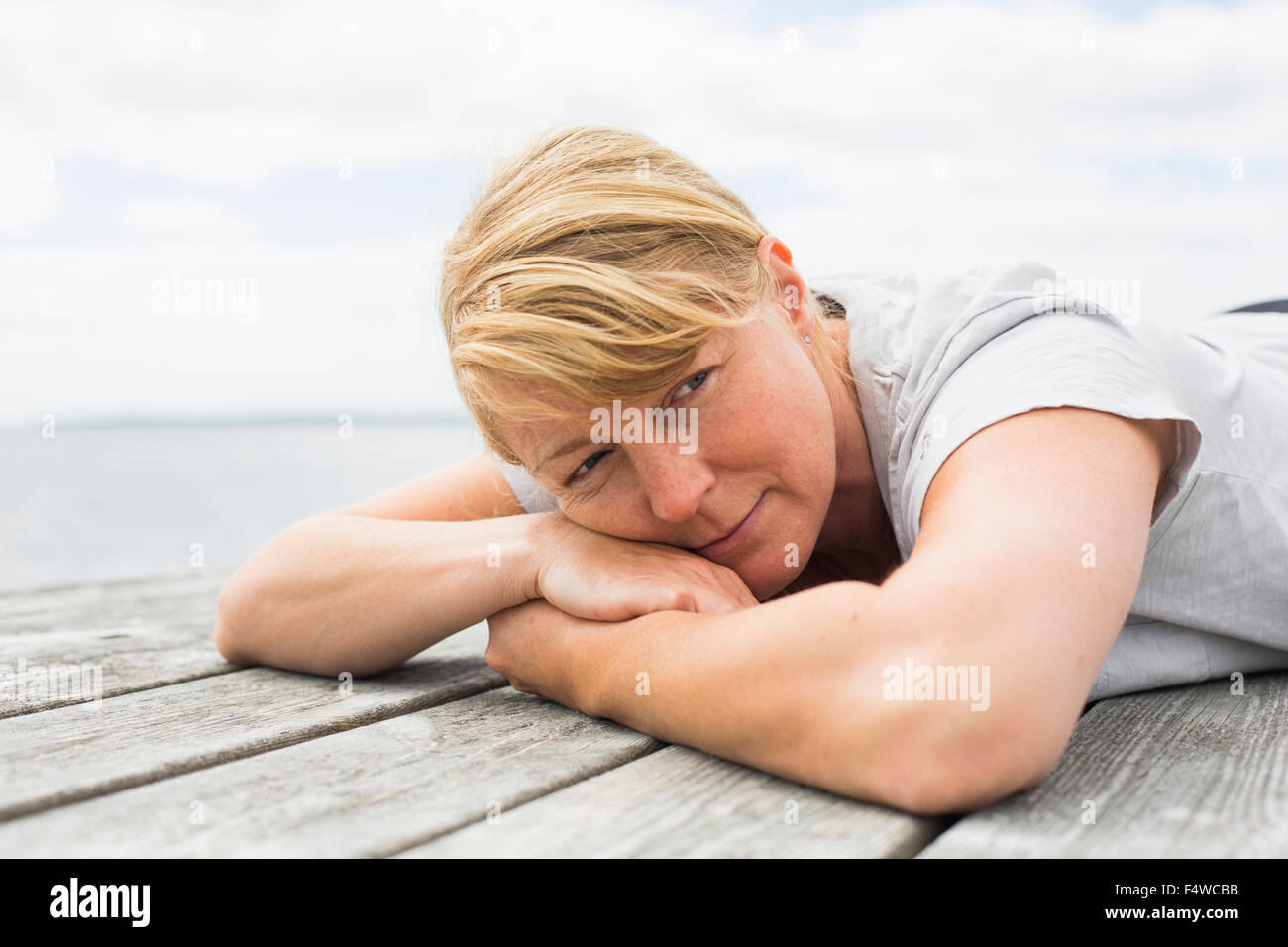 Woman lying on hi-res stock photography and images - Alamy
