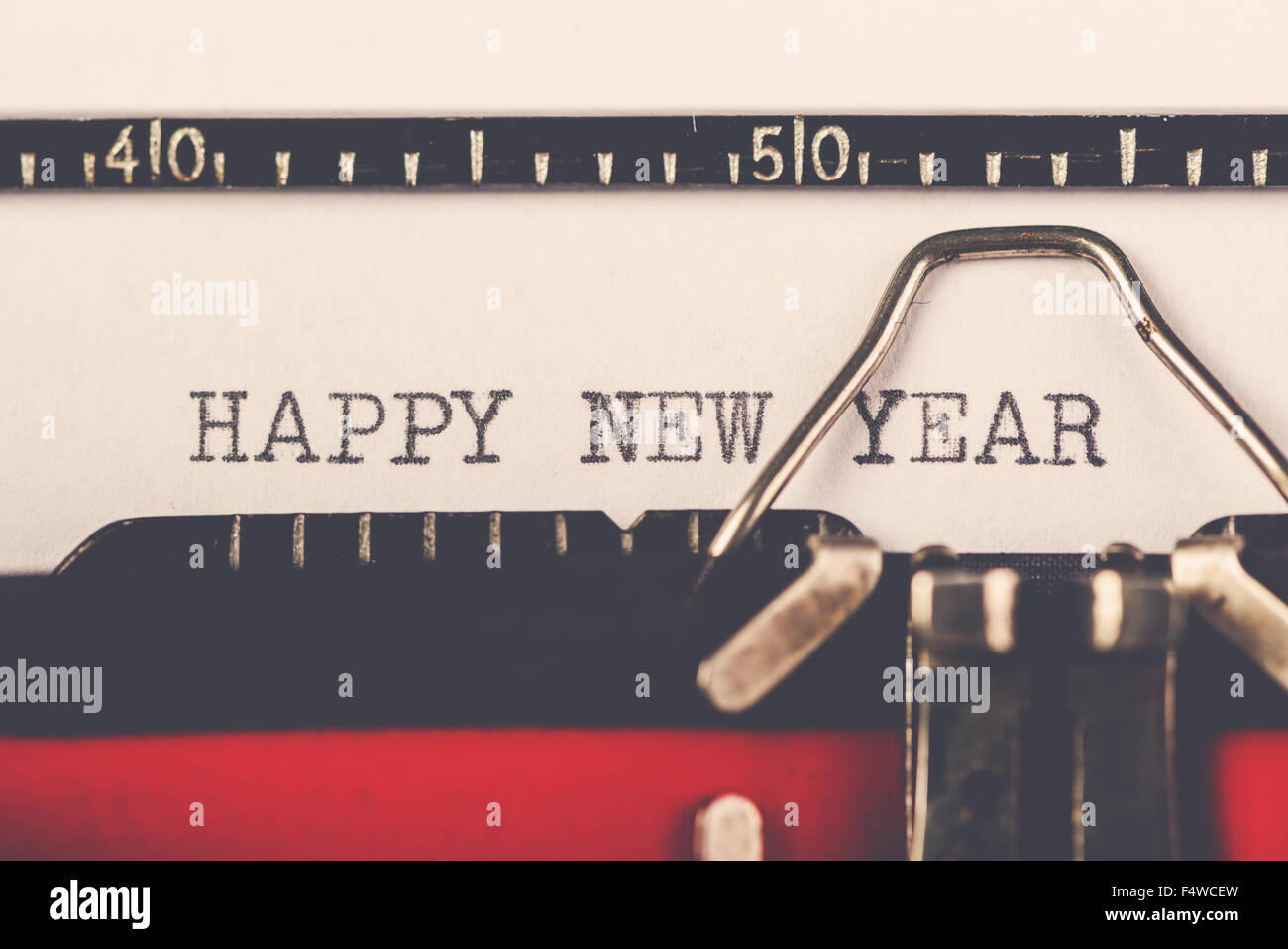 Happy New Year on old typewriter machine, hipster lifestyle holiday ...