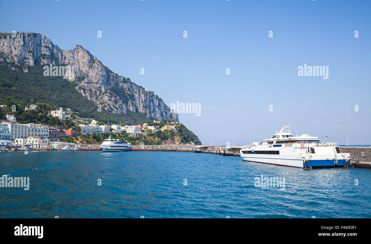 Port of Capri, Italy. Passenger ferries moored in harbor Stock Photo ...