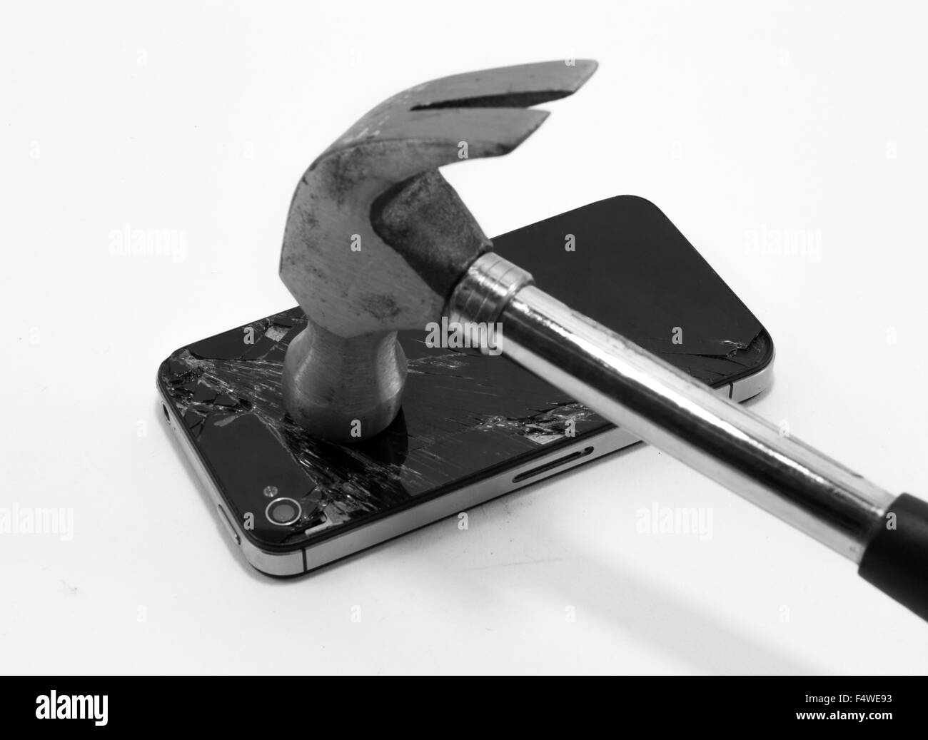 Broken mobile phone on white background Stock Photo - Alamy