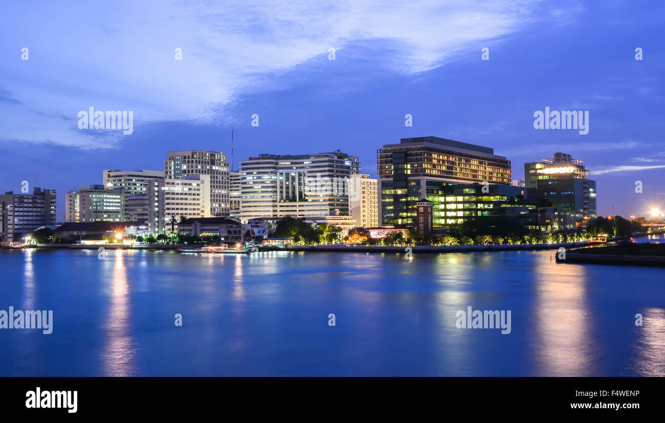 Hospital Riverside Building with water reflection during twilight Stock ...