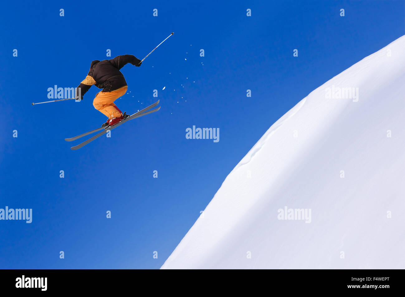 Extreme Skier in the jump in high mountains Stock Photo - Alamy