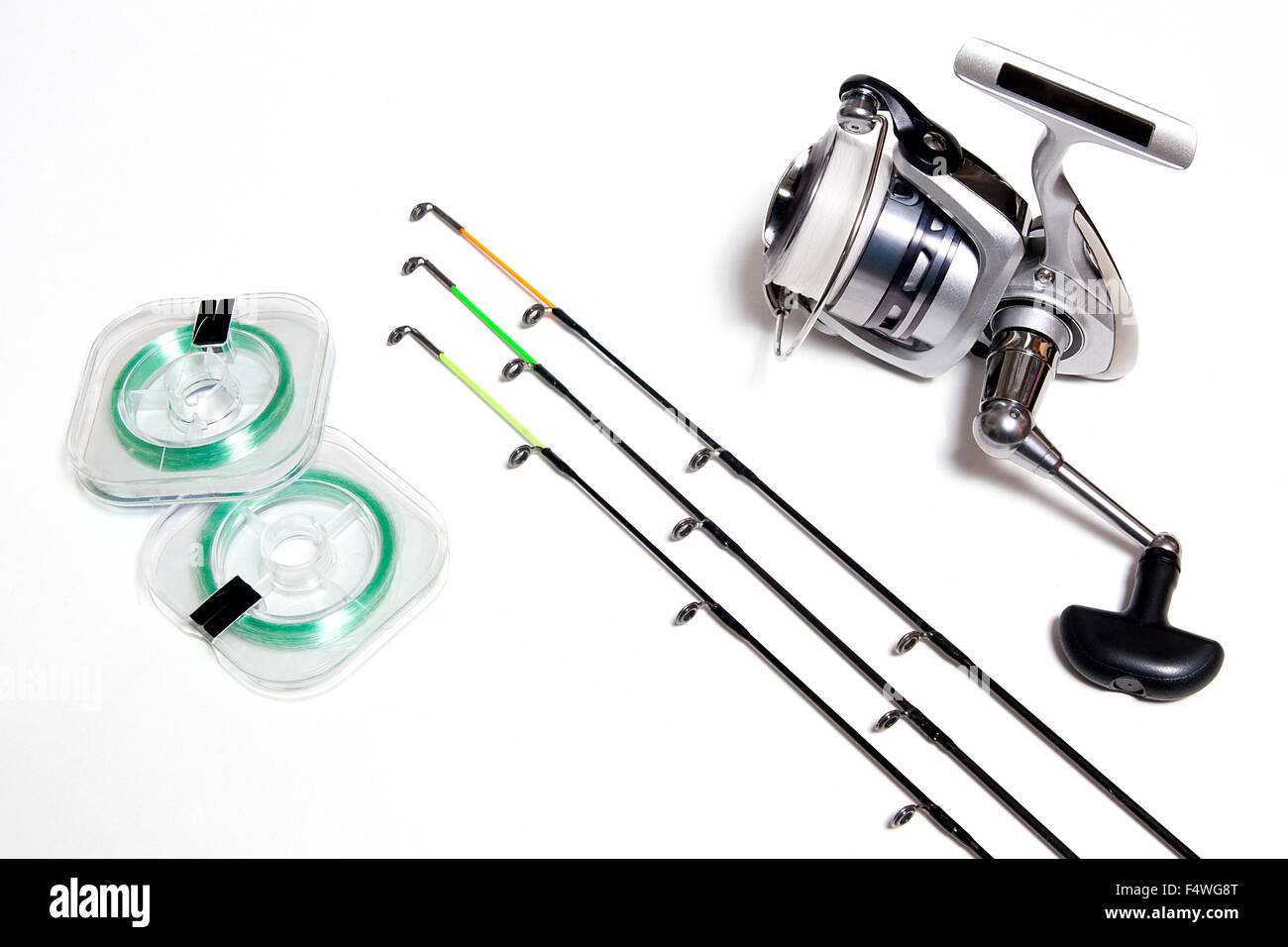 Fishing reel with accessories on white background. Fishing line, reel ...