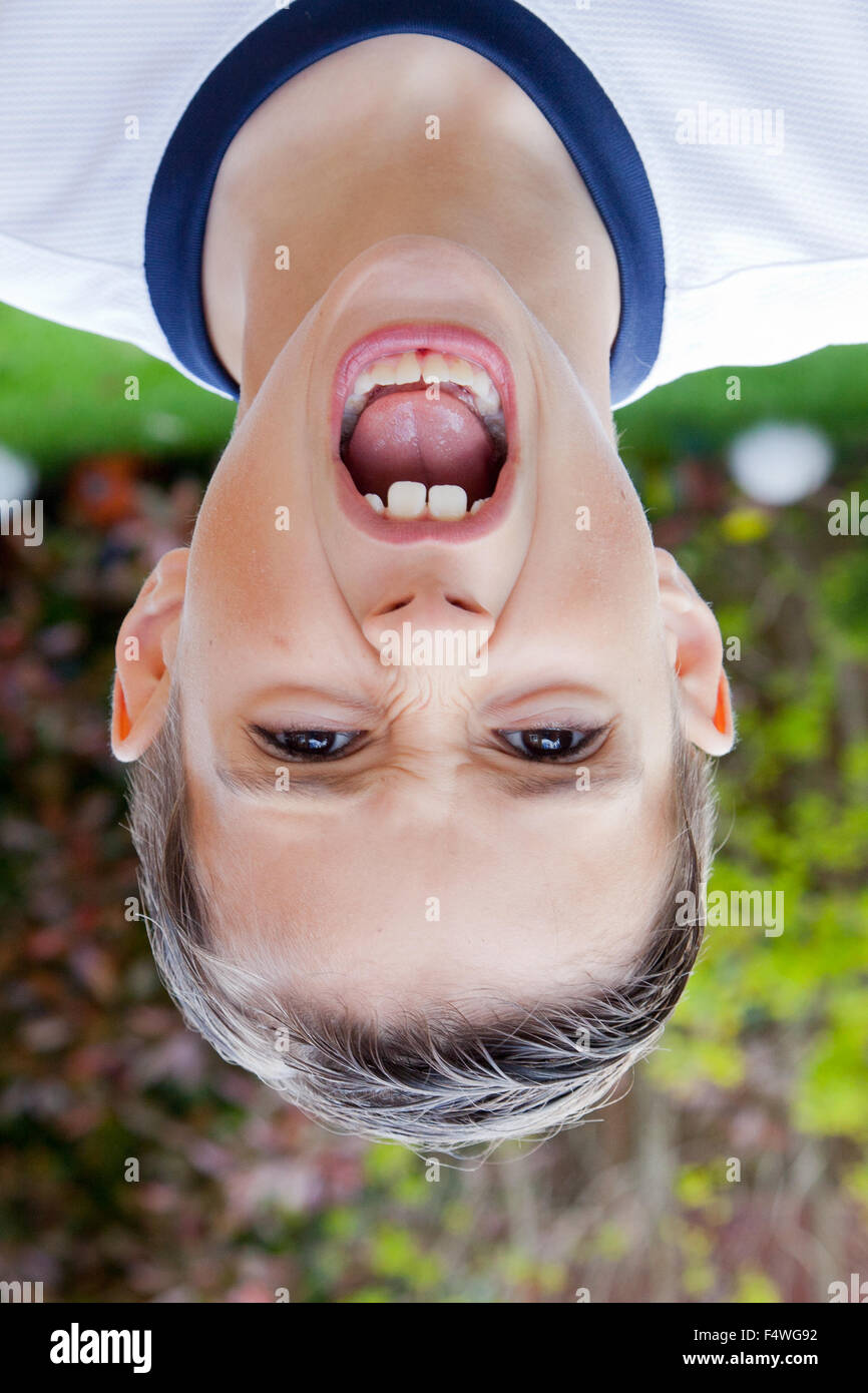 Handsome young model shouting head shot Stock Photo - Alamy