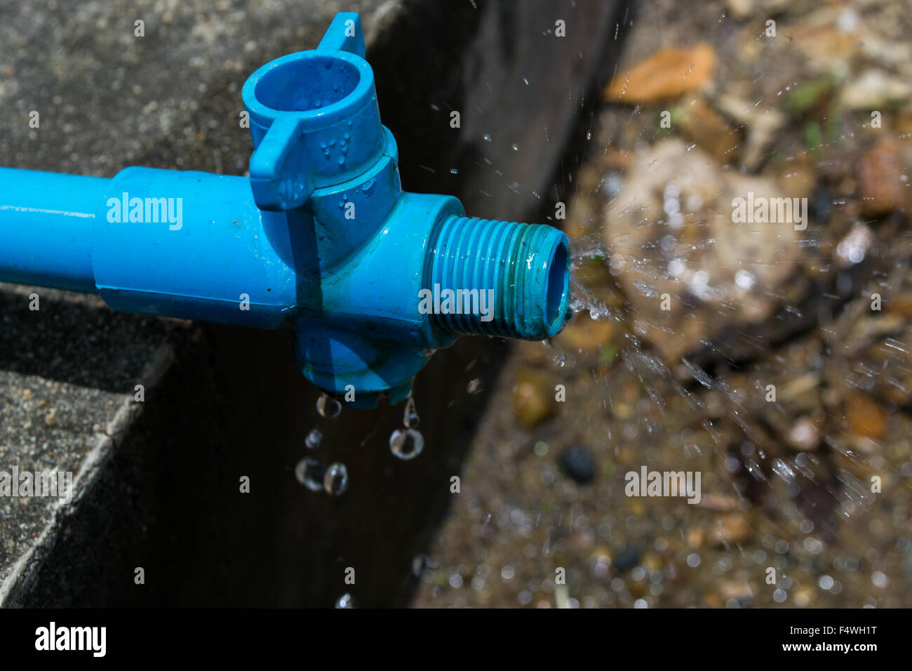 Water flows from a water pipe Stock Photo - Alamy