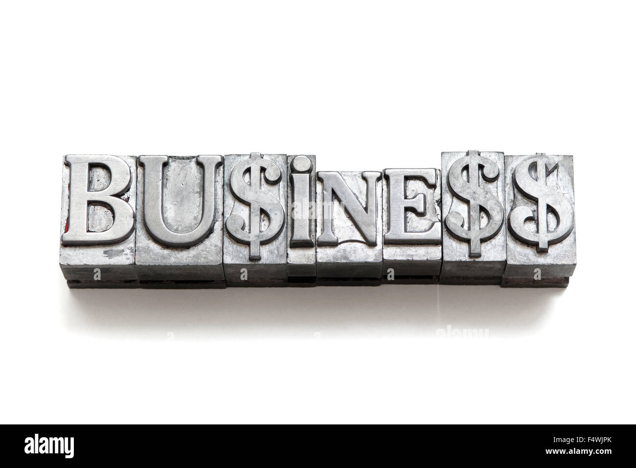 isolated business sign made from metallic letterpress blocks on white ...