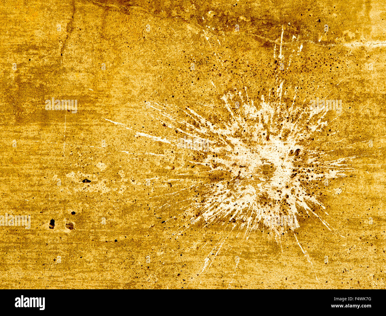 Bullet impact in yellow wall Stock Photo - Alamy