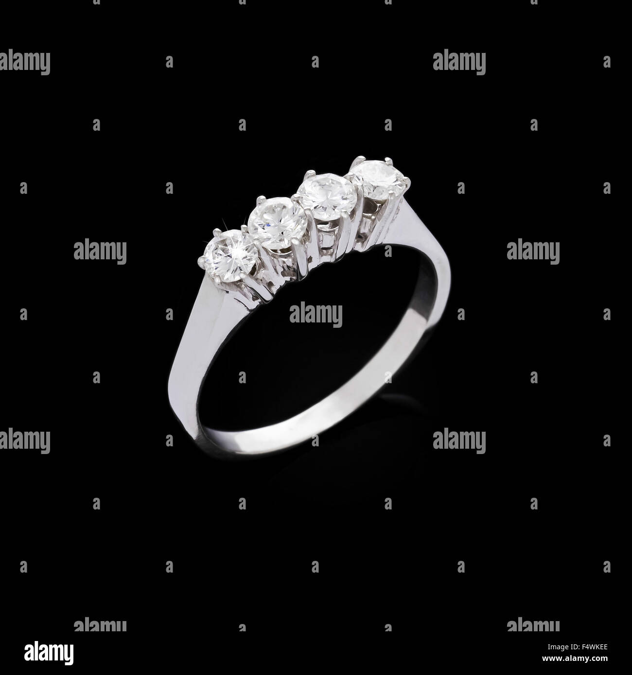 Engagement diamond ring on black background Stock Photo - Alamy