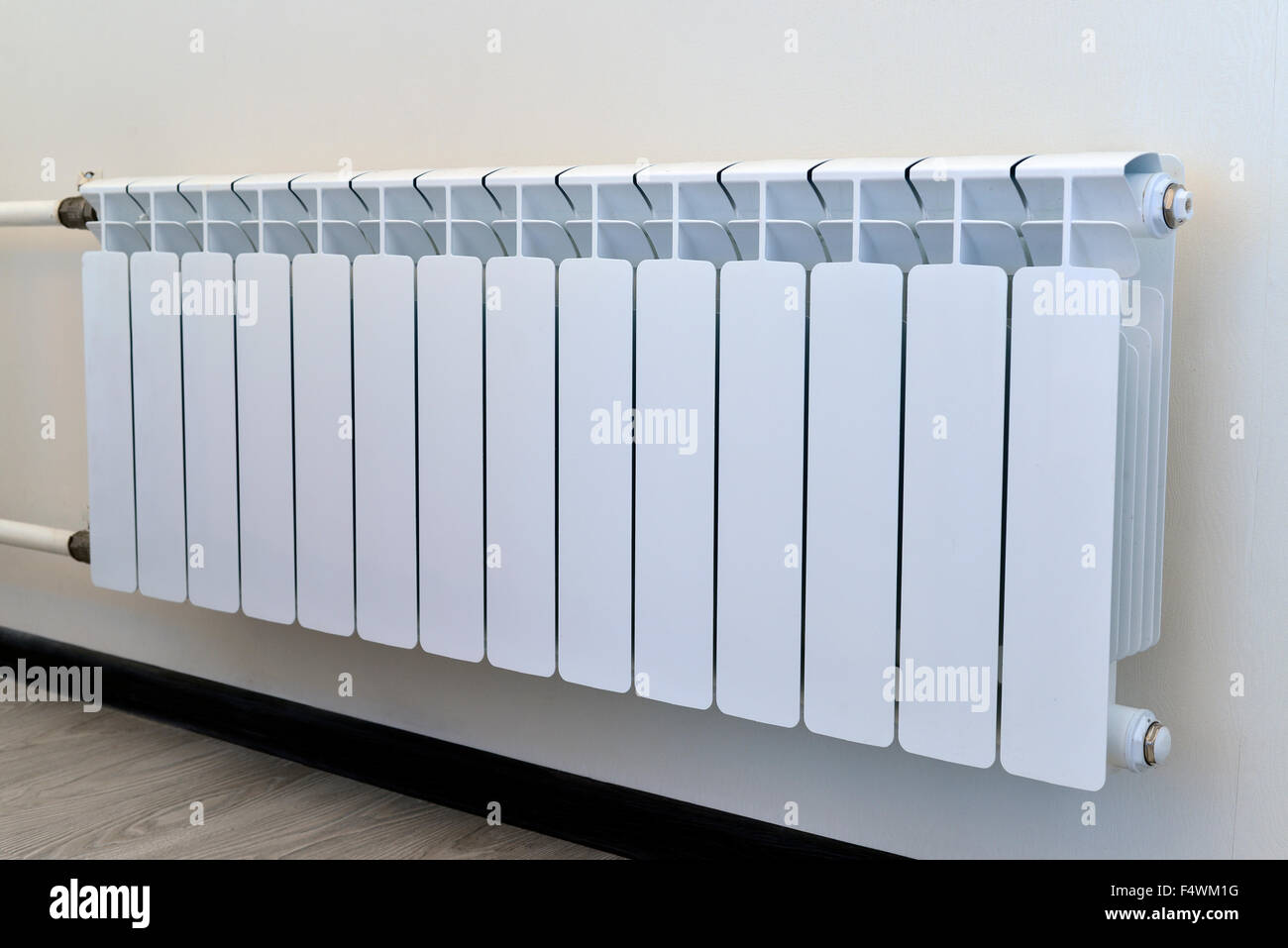 White heating radiator on the wall Stock Photo - Alamy