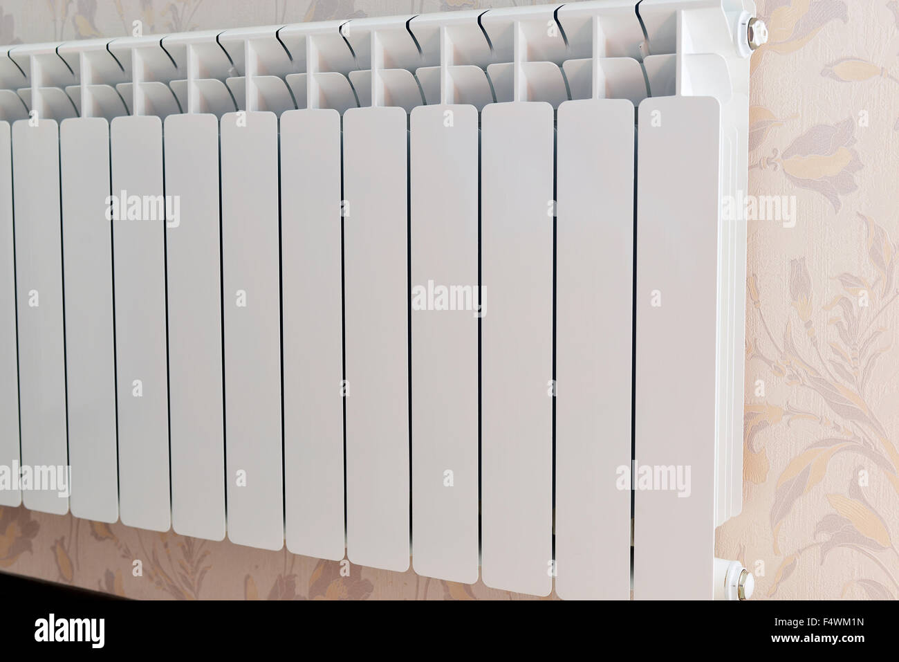 White heating radiator on the wall Stock Photo - Alamy