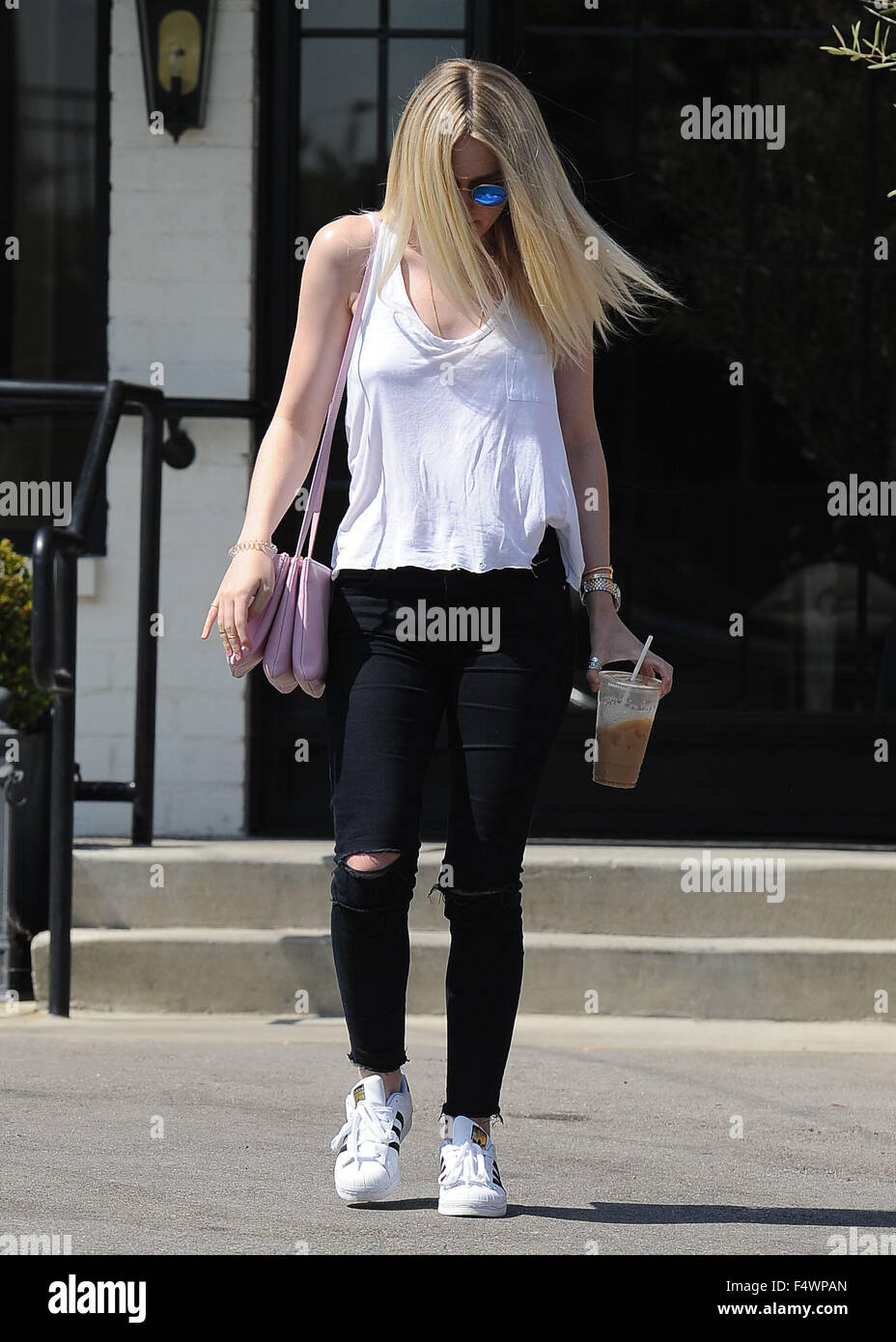 Dakota Fanning leaves Ramirez Tran salon sporting a nice new pair of ...