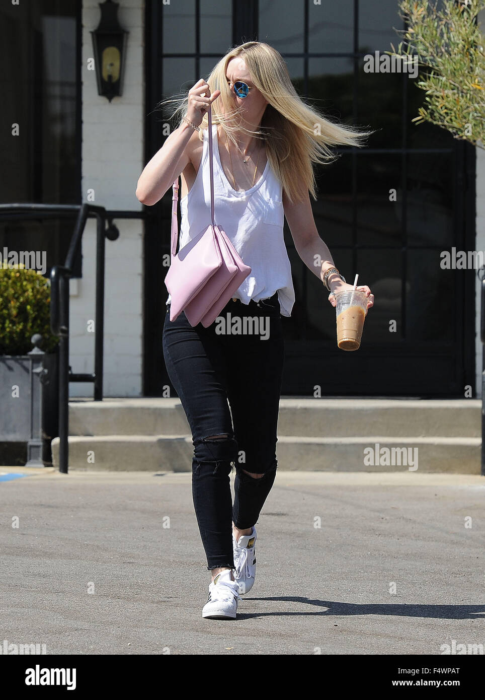 Dakota Fanning leaves Ramirez Tran salon sporting a nice new pair of ...