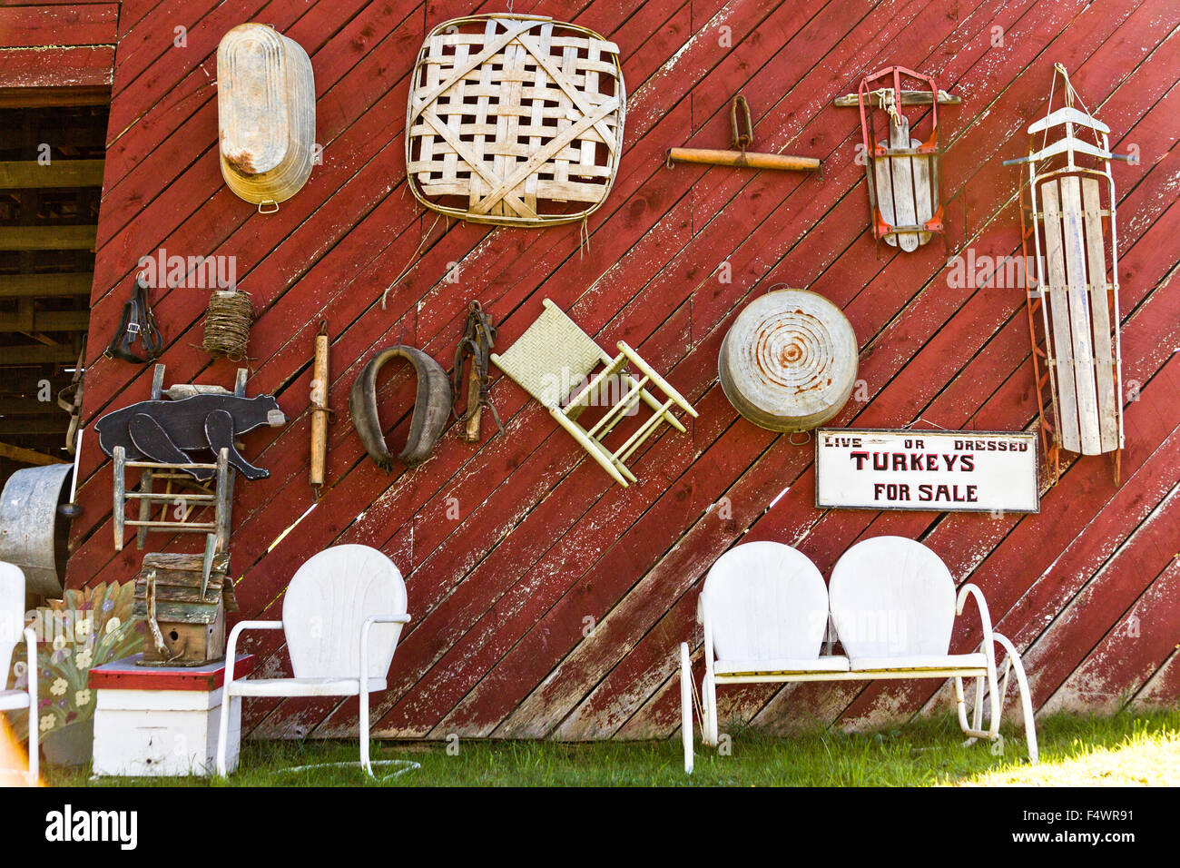 An old wooden barn decorated with an old farm implements on the Quilt ...