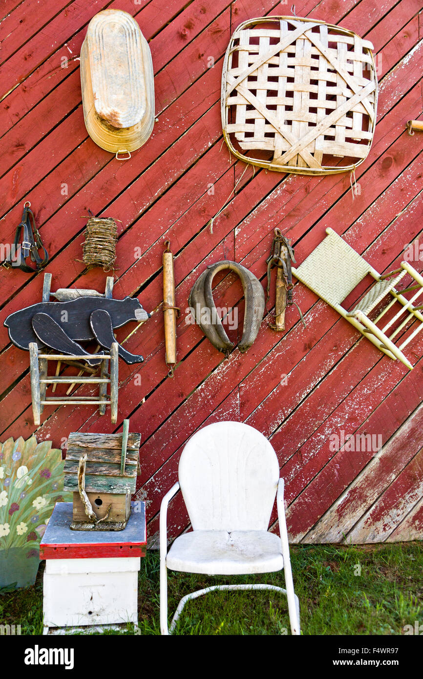 An old wooden barn decorated with an old farm implements on the Quilt ...