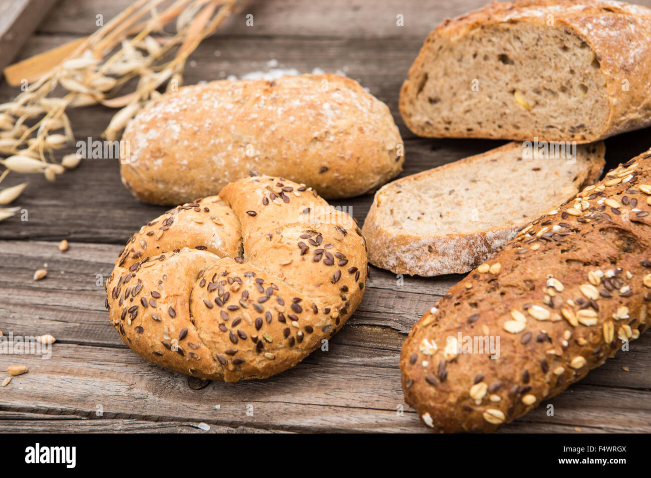 Rustic bakery and wheat on an old vintage planked wood table Stock ...