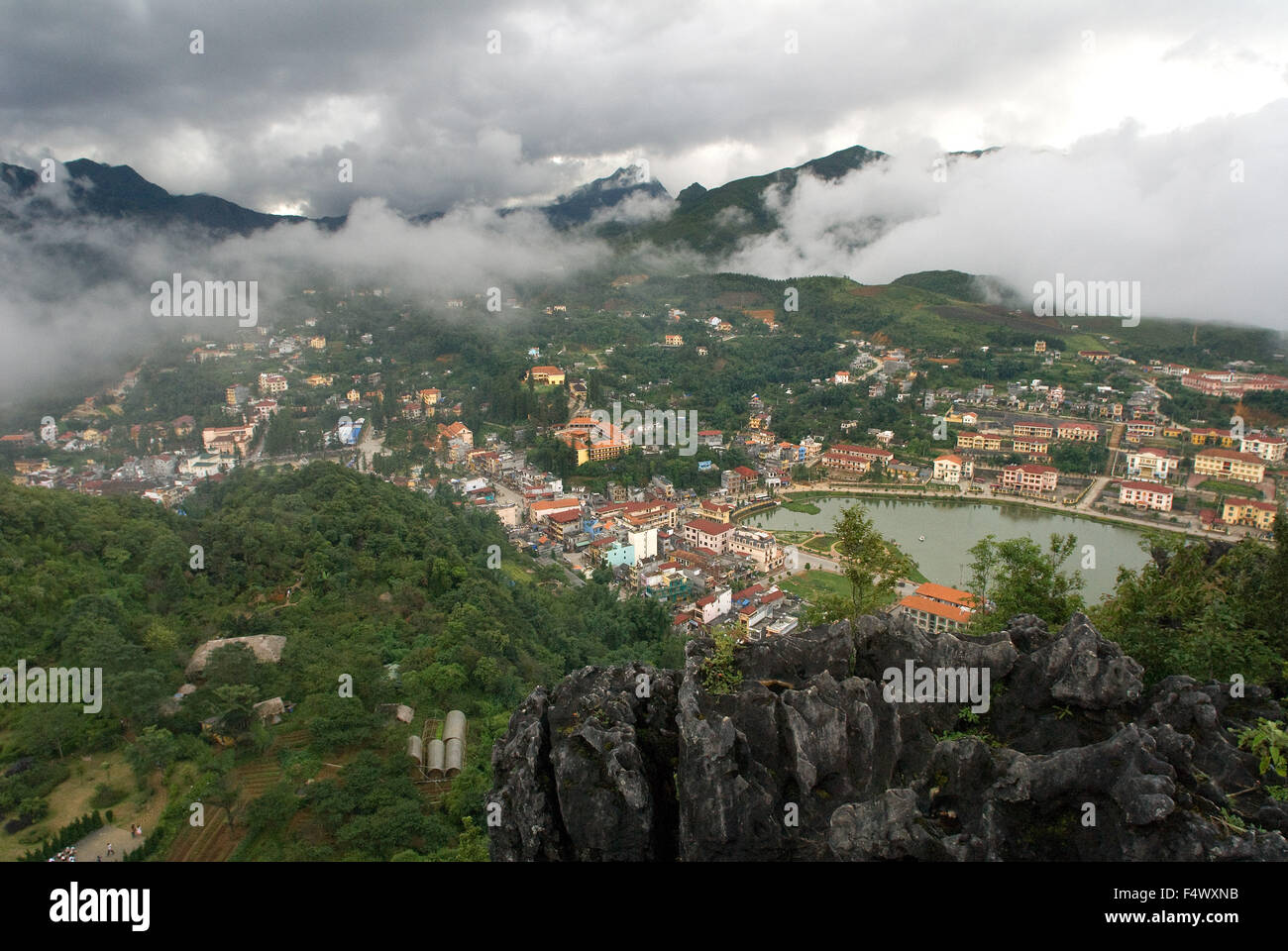 Sapa Village. Aerial view of clusters of buildings nestled in the green ...