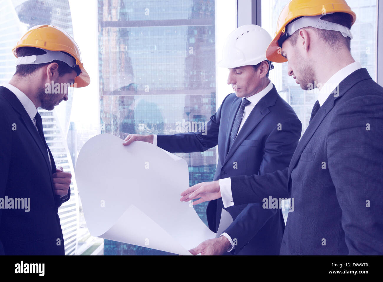 Businessmen and architect team in office planning construction project ...