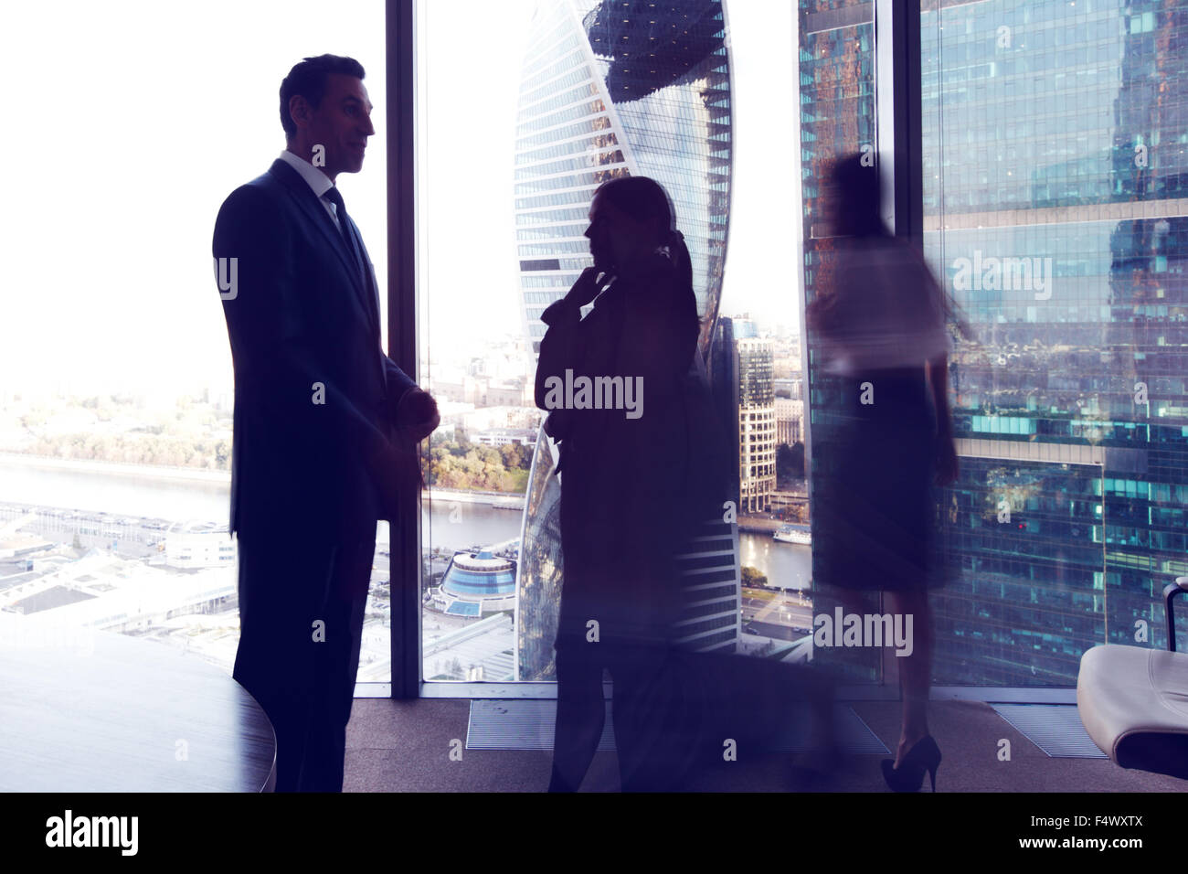 Business people talking in a conference room with city skyline Stock ...