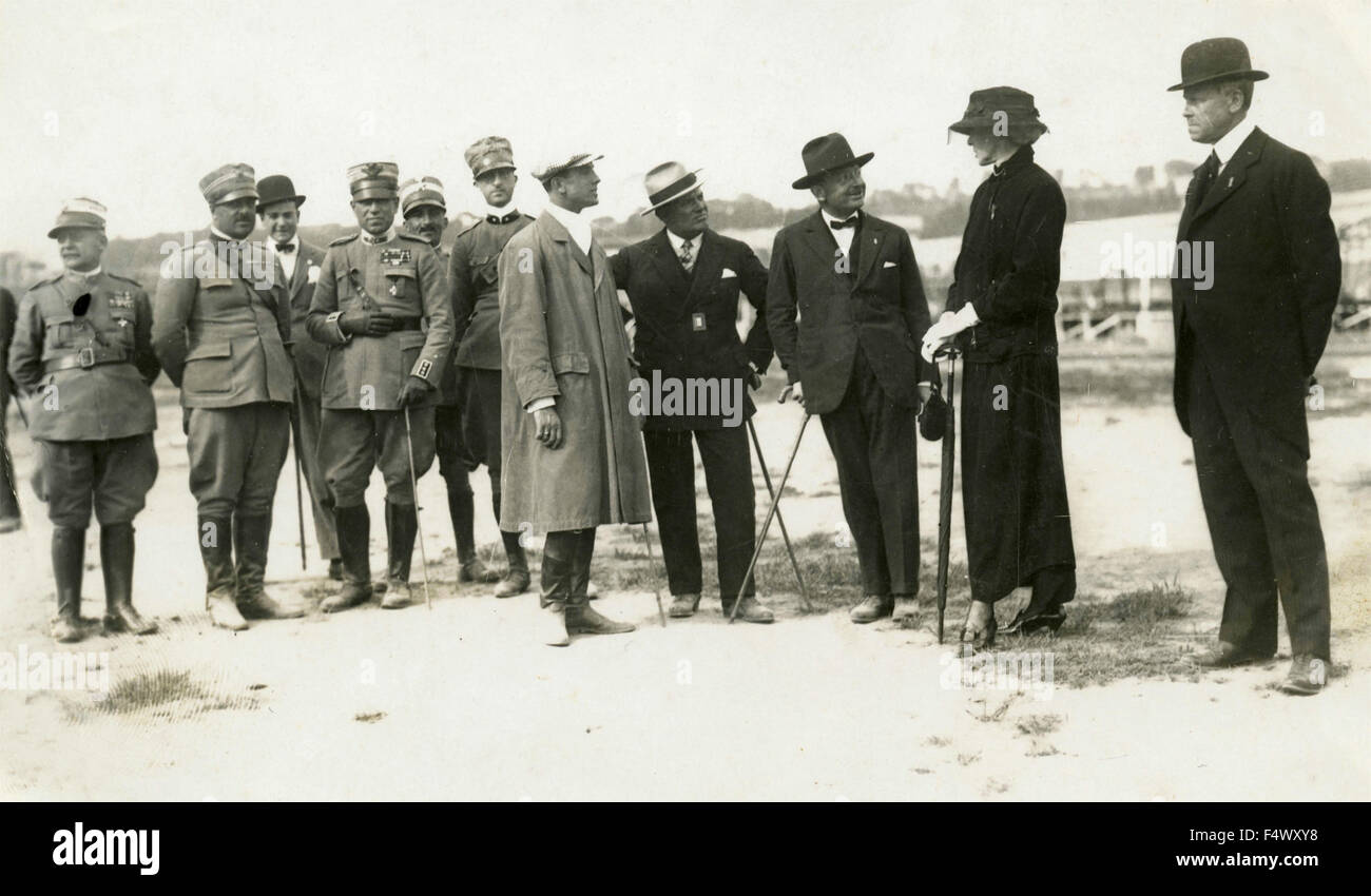 An aristocratic lady with a bodyguard visiting a military base, Italy ...