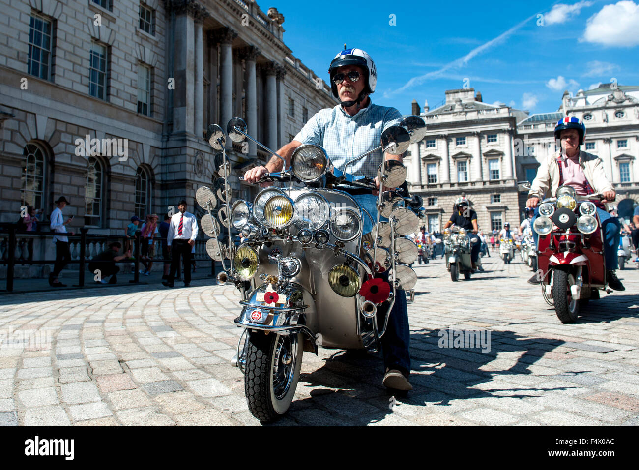 Around 30 Mods on scooters, including Vespas and Lambrettas, arrive to ...