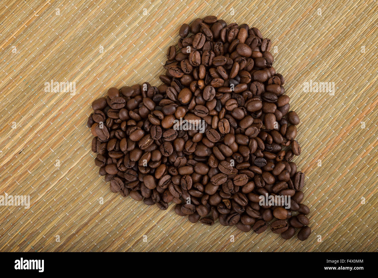 Heart shape made by coffee beans Stock Photo - Alamy